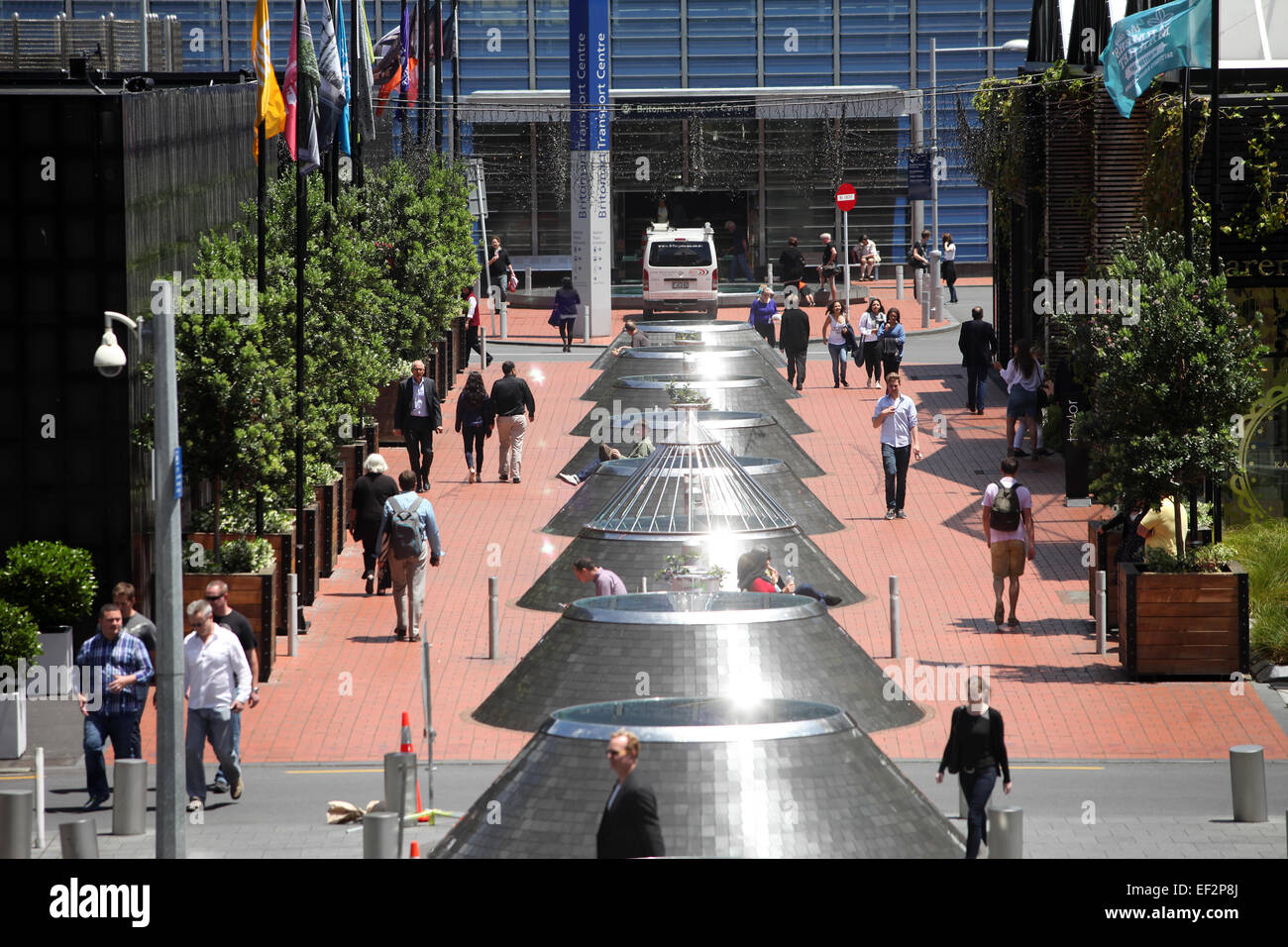 Lunchtime shoppers and workers stroll through Takutai Square, in the ...