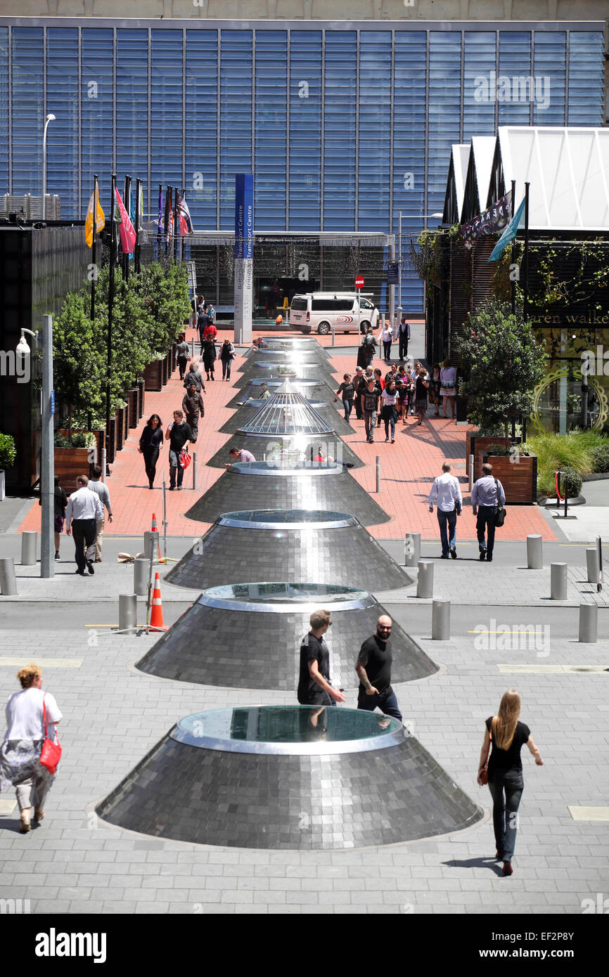 Lunchtime shoppers and workers stroll through Takutai Square, in the ...
