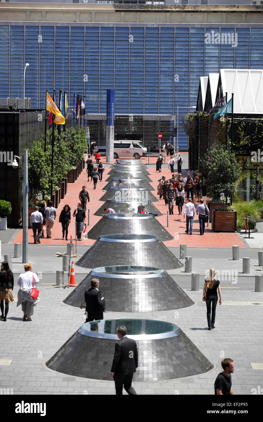 Lunchtime shoppers and workers stroll through Takutai Square, in the ...