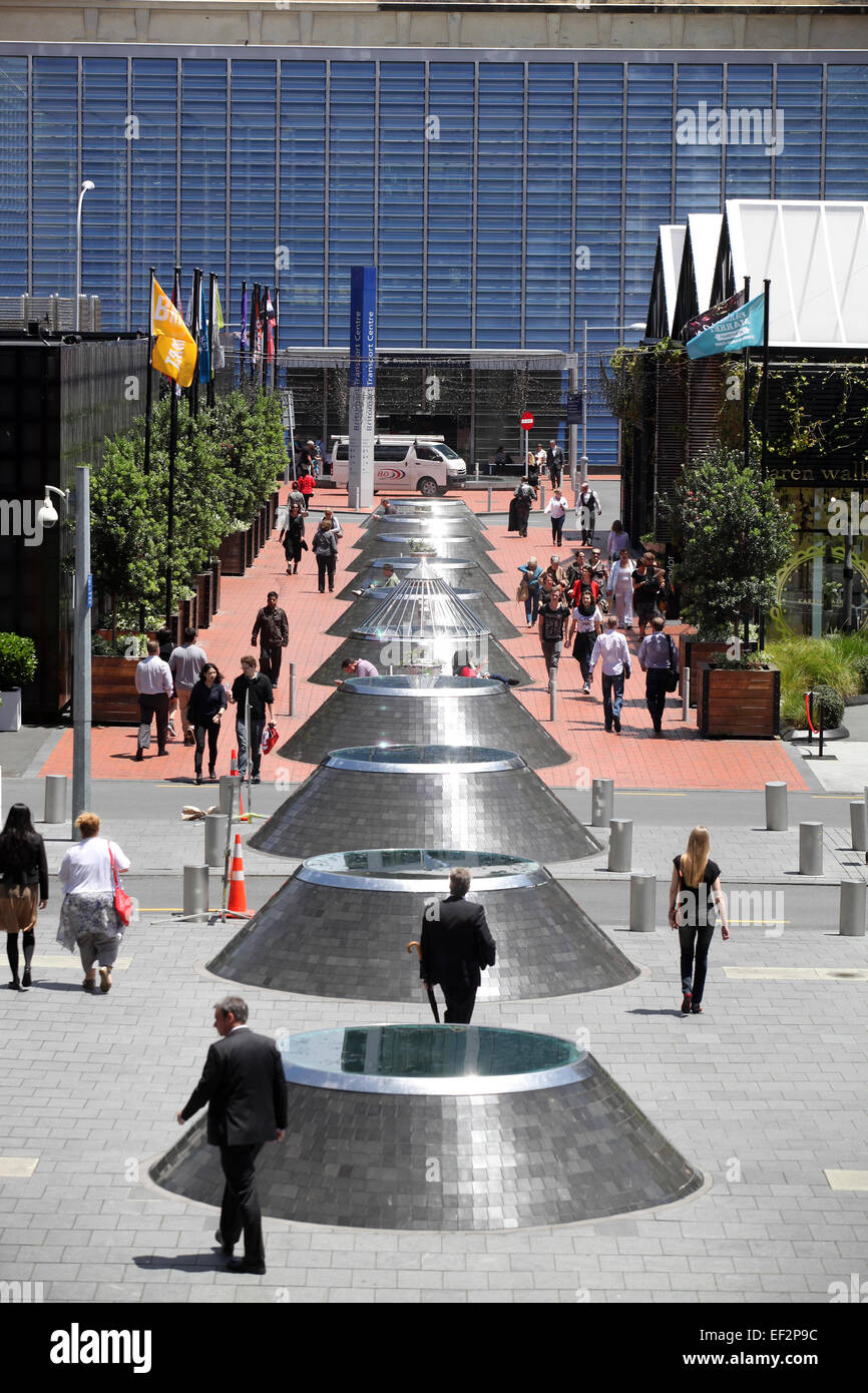 Lunchtime shoppers and workers stroll through Takutai Square, in the ...