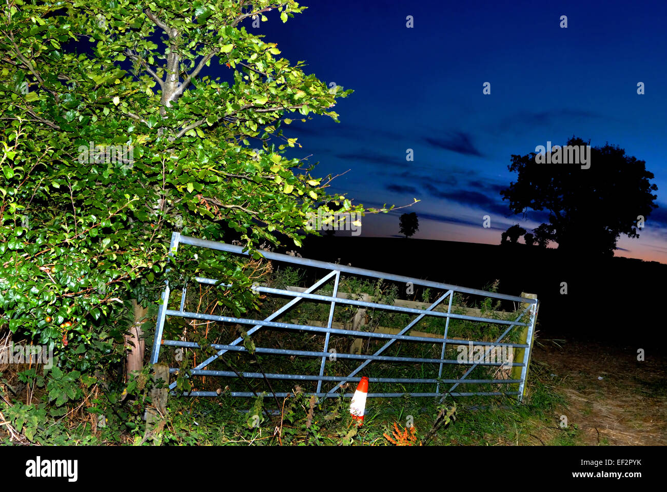 Sunset over farm gate Stock Photo - Alamy