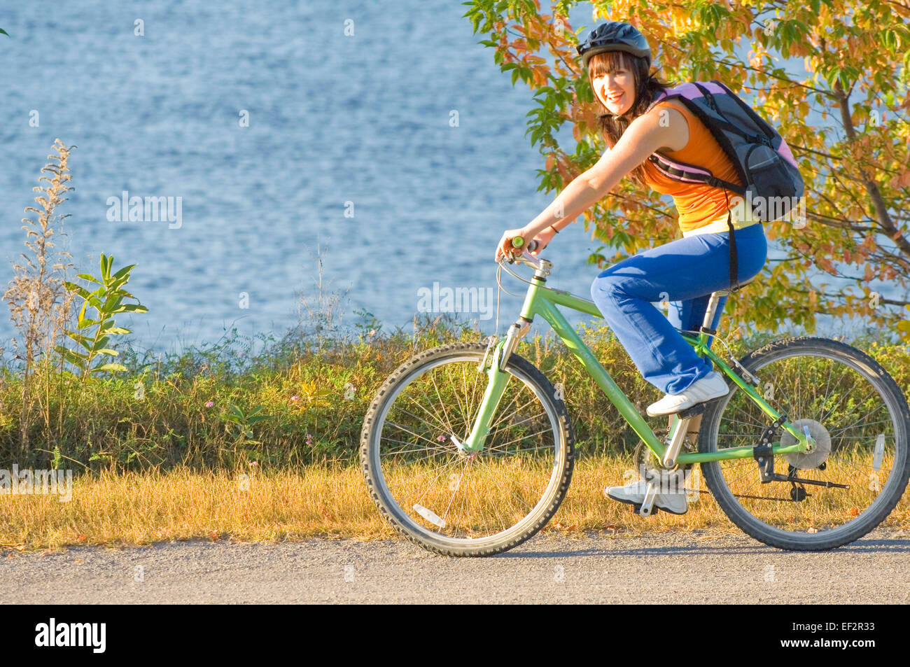 Cyclist riding on bike path Stock Photo - Alamy