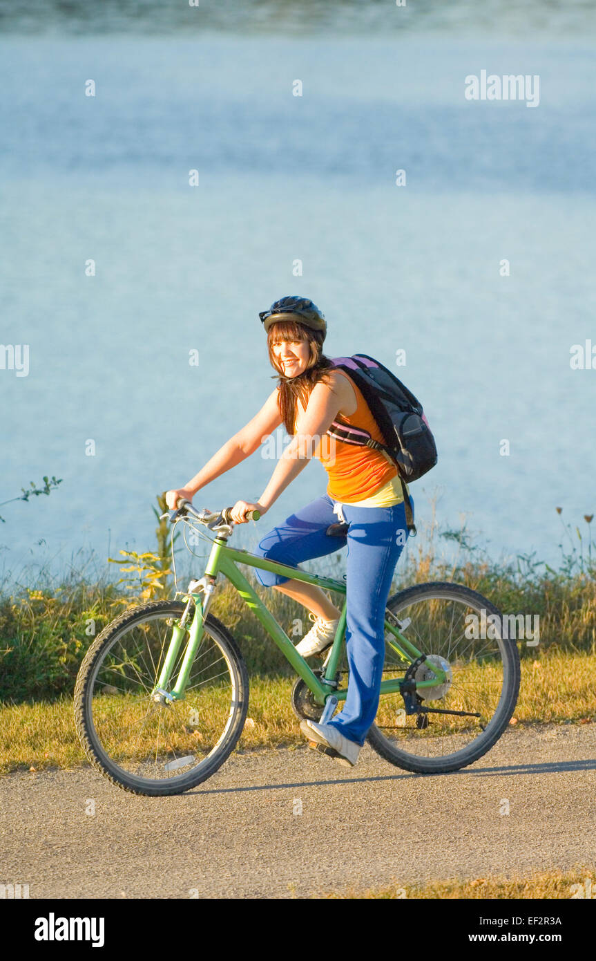 Cyclist riding on bike path Stock Photo - Alamy