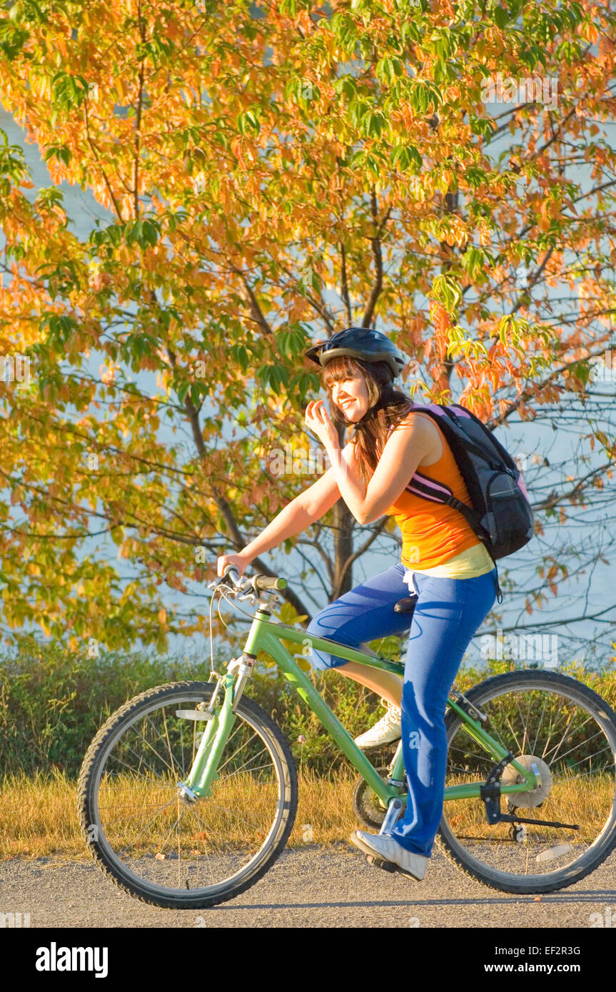 Cyclist riding on bike path Stock Photo - Alamy