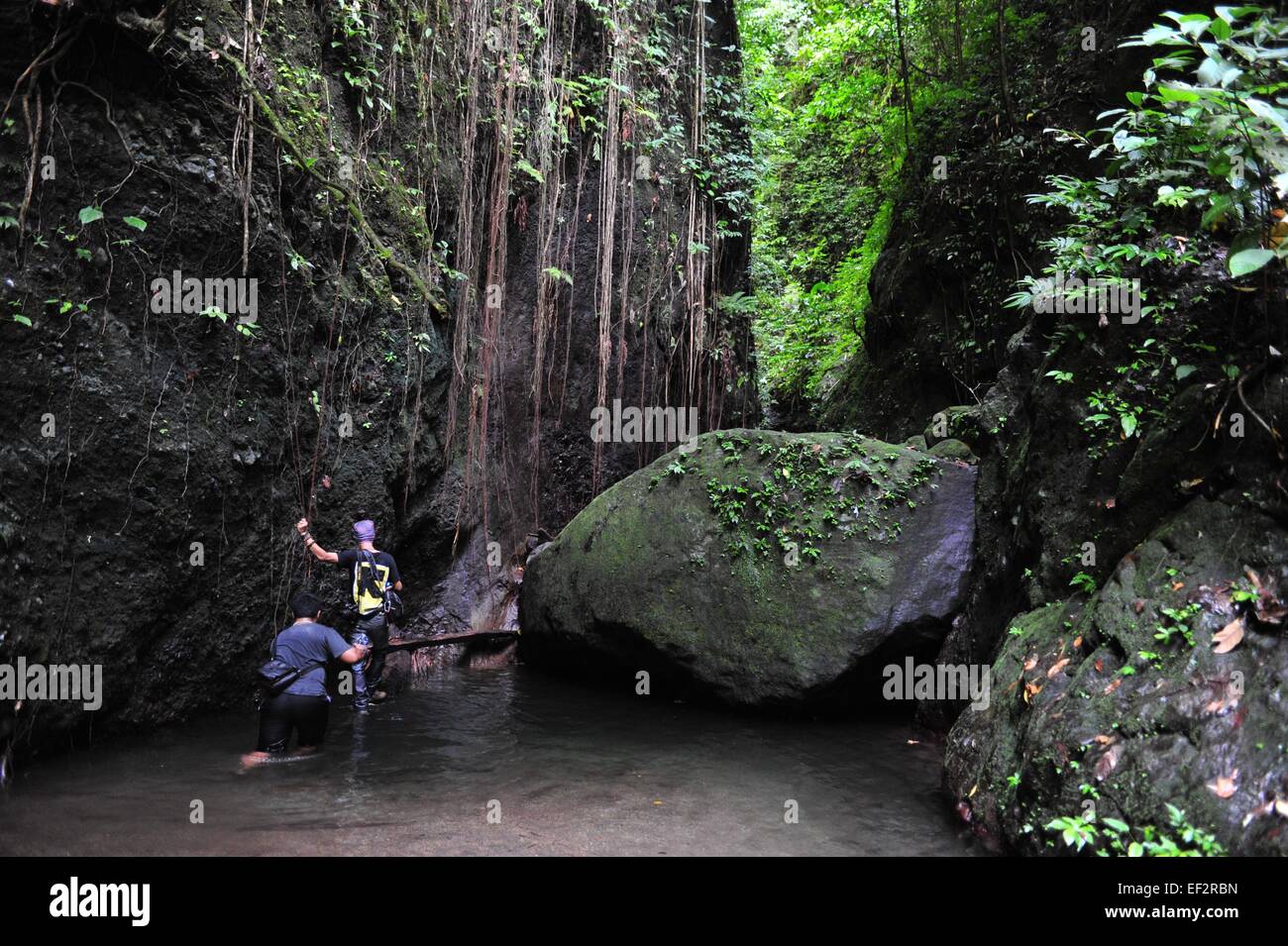 Sangihe, Indonesia. 25th Jan, 2015. Visitors walk in a river in the ...