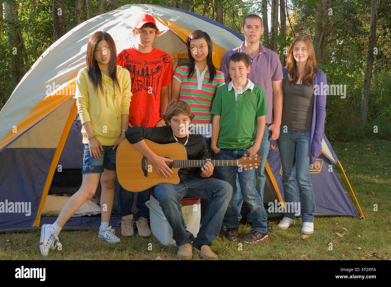 Group of friends in front of tent Stock Photo - Alamy