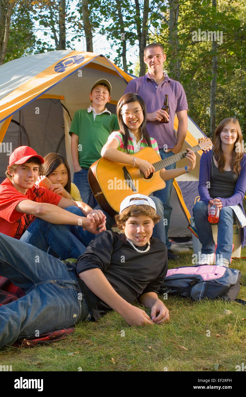 Group of friends in front of tent Stock Photo - Alamy