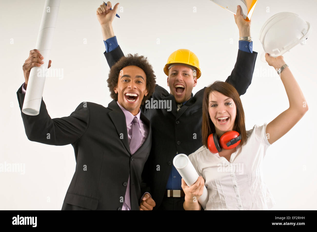 Three excited business people cheering Stock Photo - Alamy