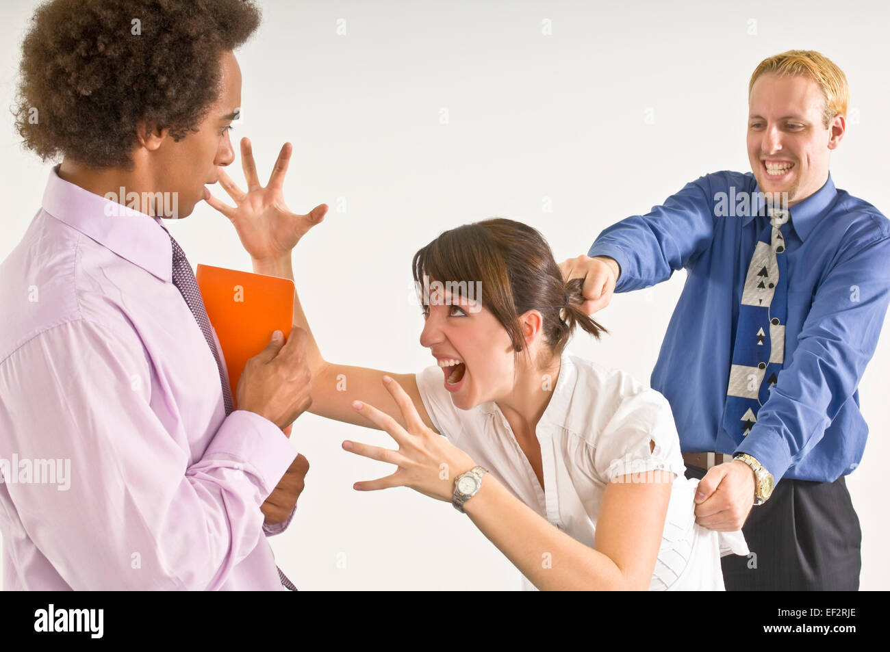 Man trying to stop woman from attacking another man Stock Photo - Alamy