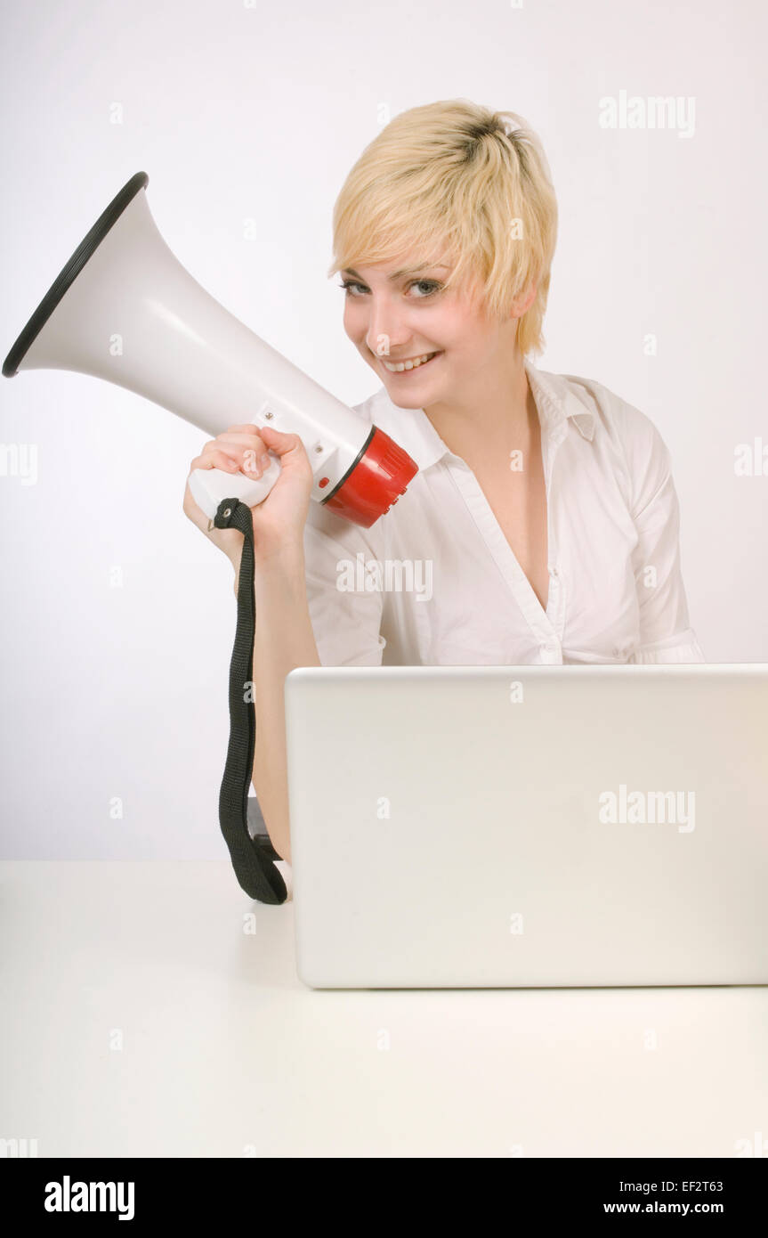 Blond woman holding a bullhorn Stock Photo - Alamy