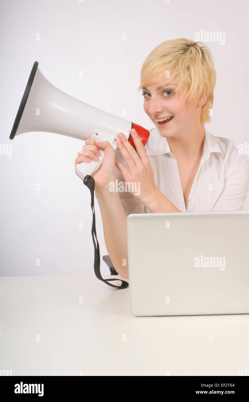 Blond woman holding a bullhorn Stock Photo - Alamy