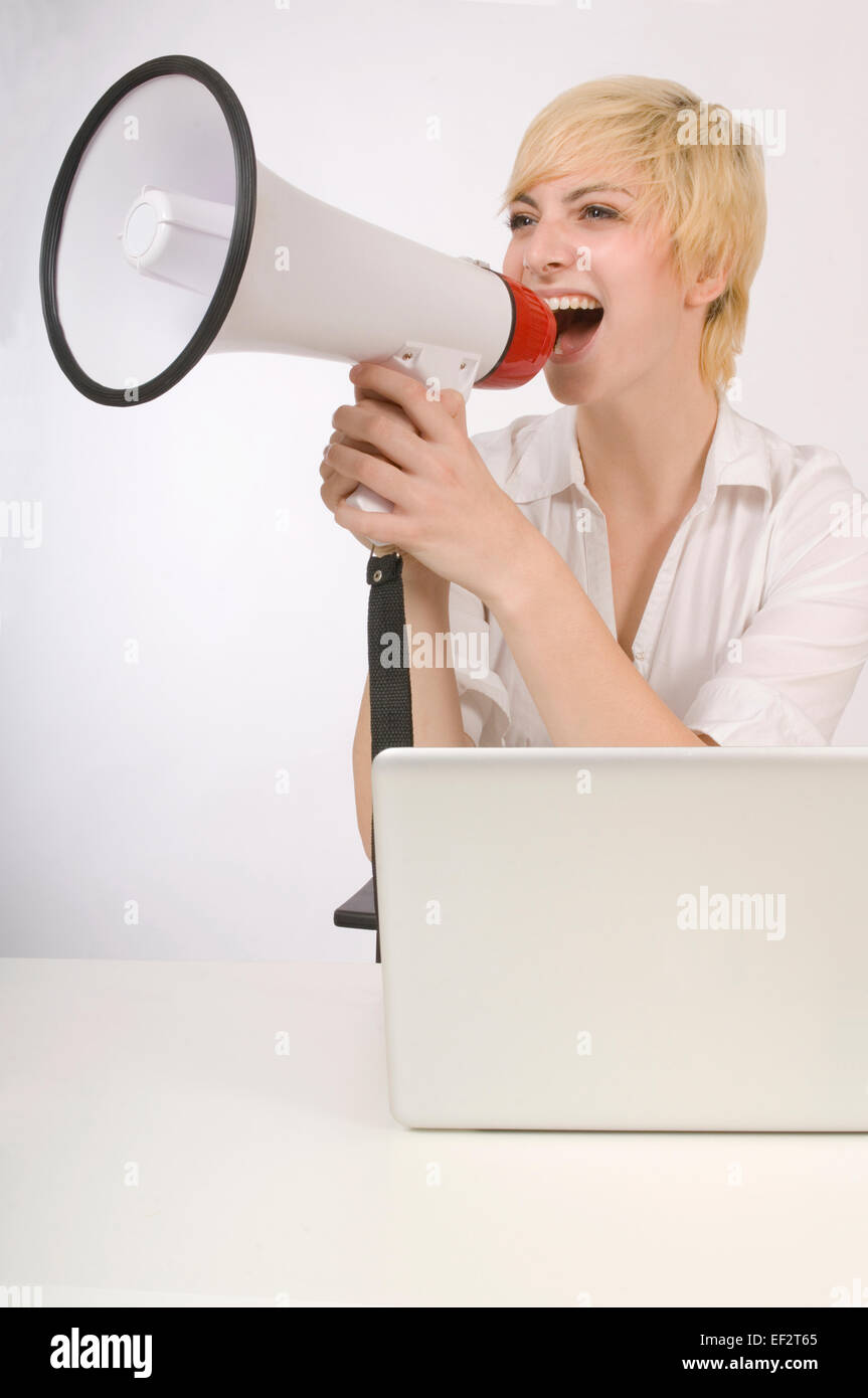 Blond yelling into a bullhorn Stock Photo - Alamy