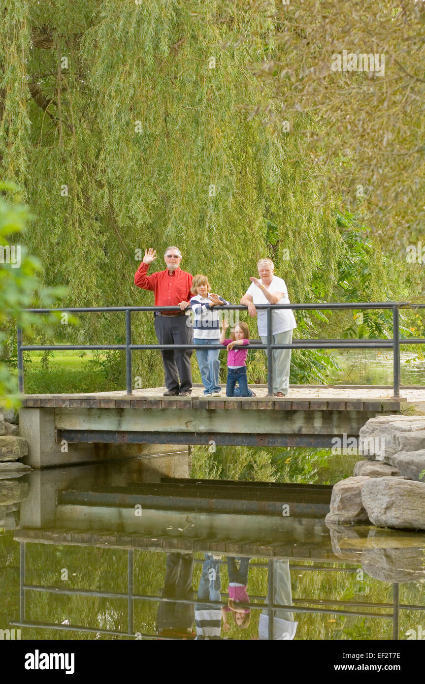Family on bridge Stock Photo - Alamy