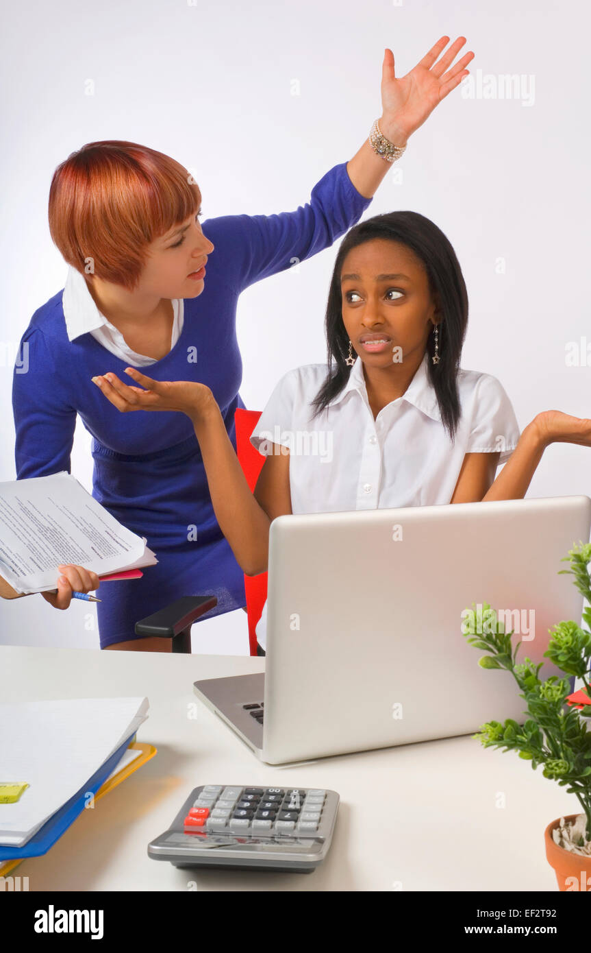 Businesswoman reprimanding an office worker Stock Photo - Alamy