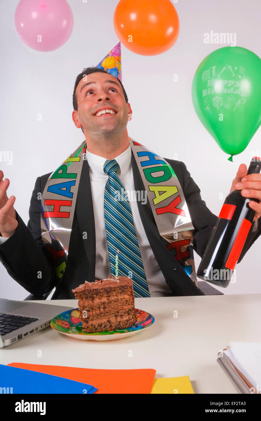 Businessman at a work birthday celebration Stock Photo - Alamy