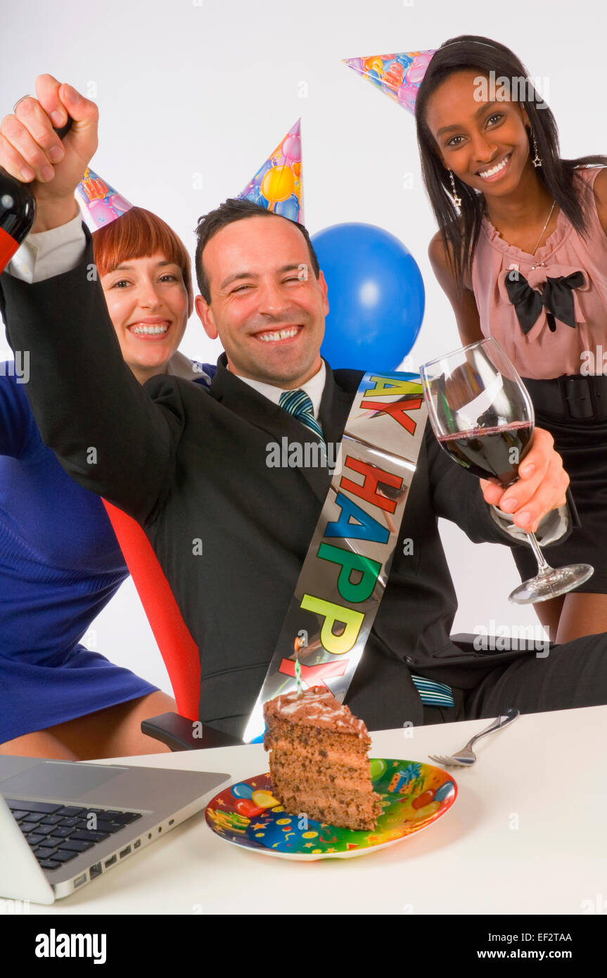 Excited businessman celebrating his birthday with his colleagues Stock ...