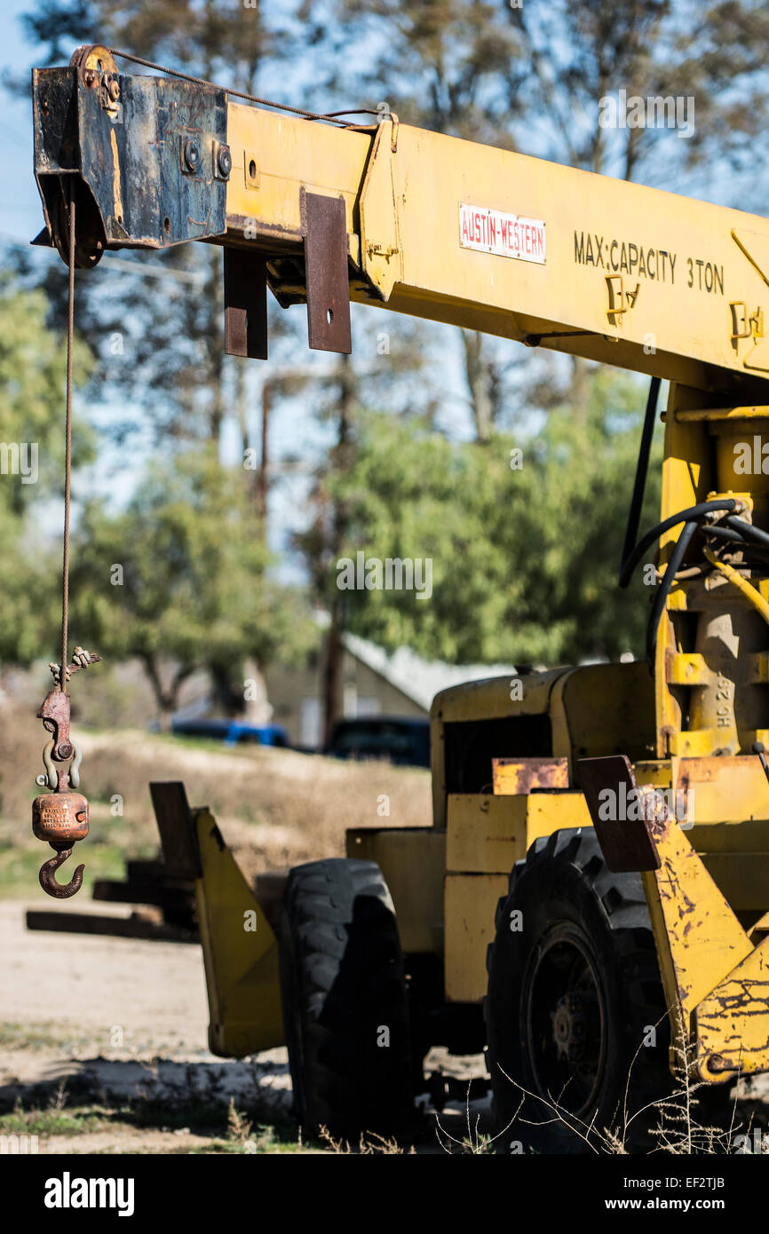 A construction vehicle with a pulley crane Stock Photo - Alamy