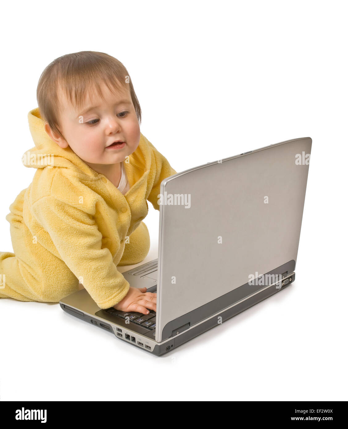 Toddler playing with laptop Stock Photo - Alamy