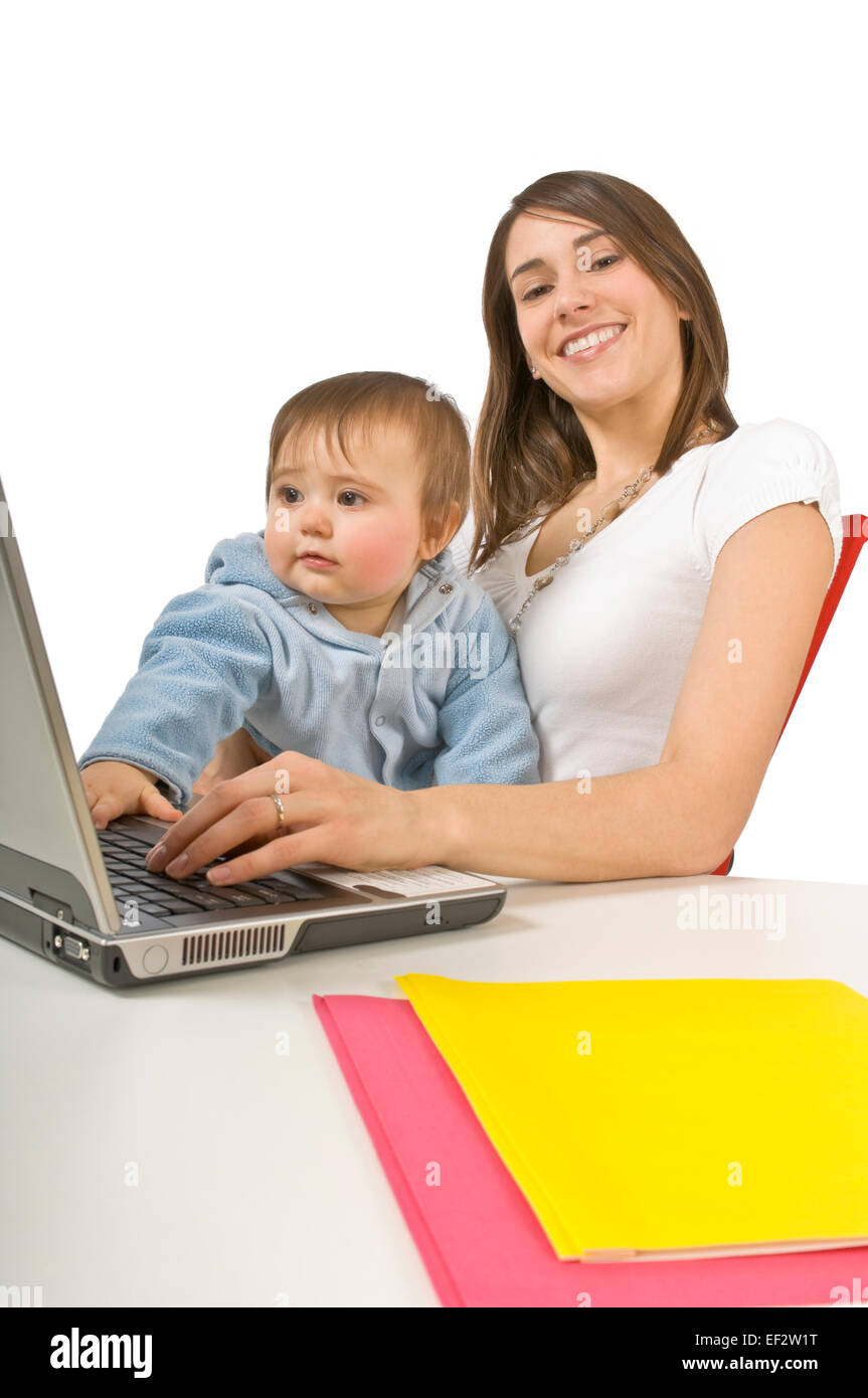 Mother and baby playing with laptop Stock Photo - Alamy