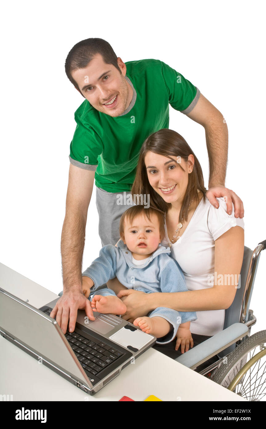 Parents looking at laptop Stock Photo - Alamy