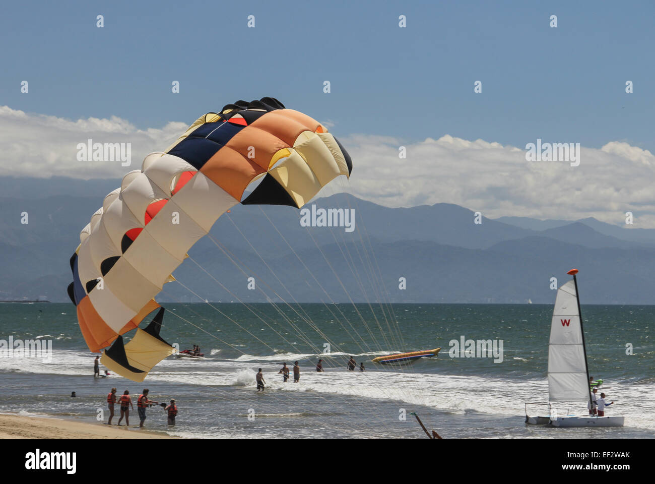 Playing parasailing on beach hi-res stock photography and images - Alamy