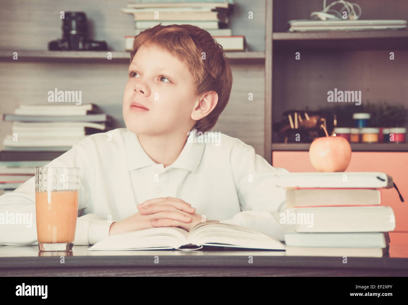 Thoughtful boy reading hi-res stock photography and images - Alamy