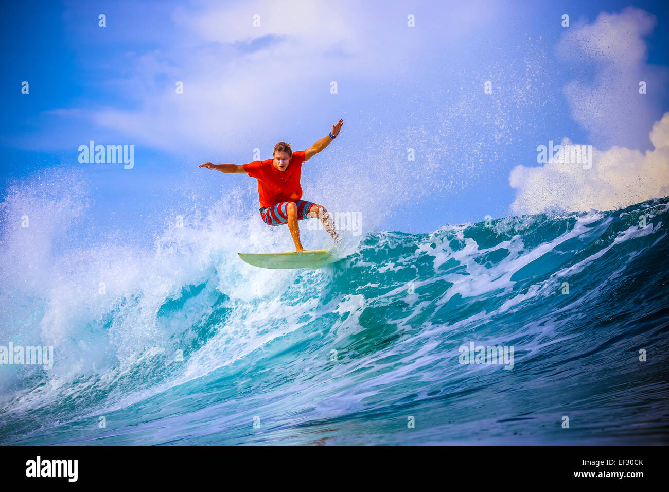 Surfer on Amazing Blue Wave, Bali island Stock Photo - Alamy