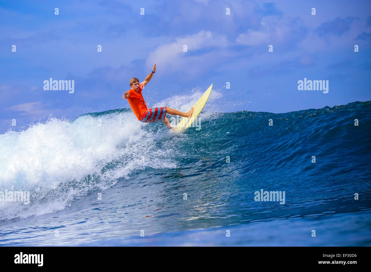 Surfer on Amazing Blue Wave, Bali island Stock Photo - Alamy