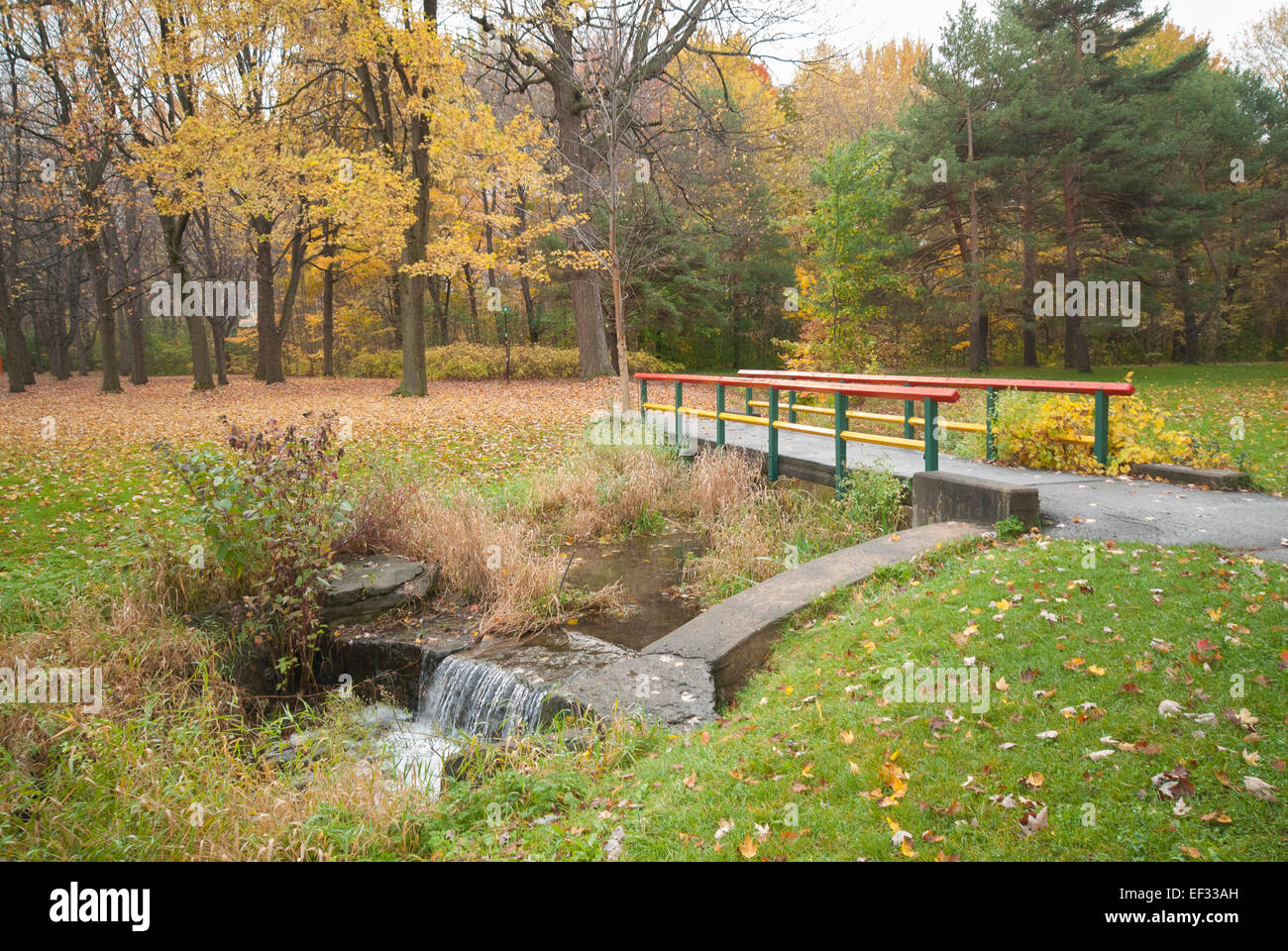 Bridge with small water fall Stock Photo - Alamy