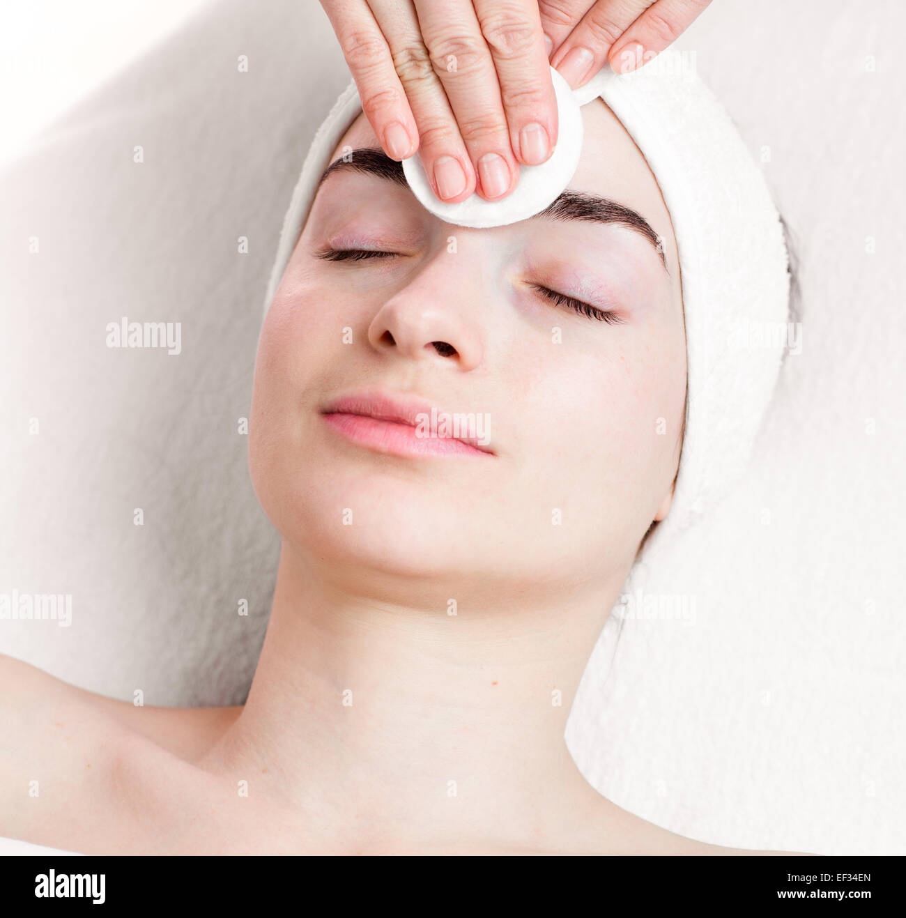 Woman removing face mask hi-res stock photography and images - Alamy