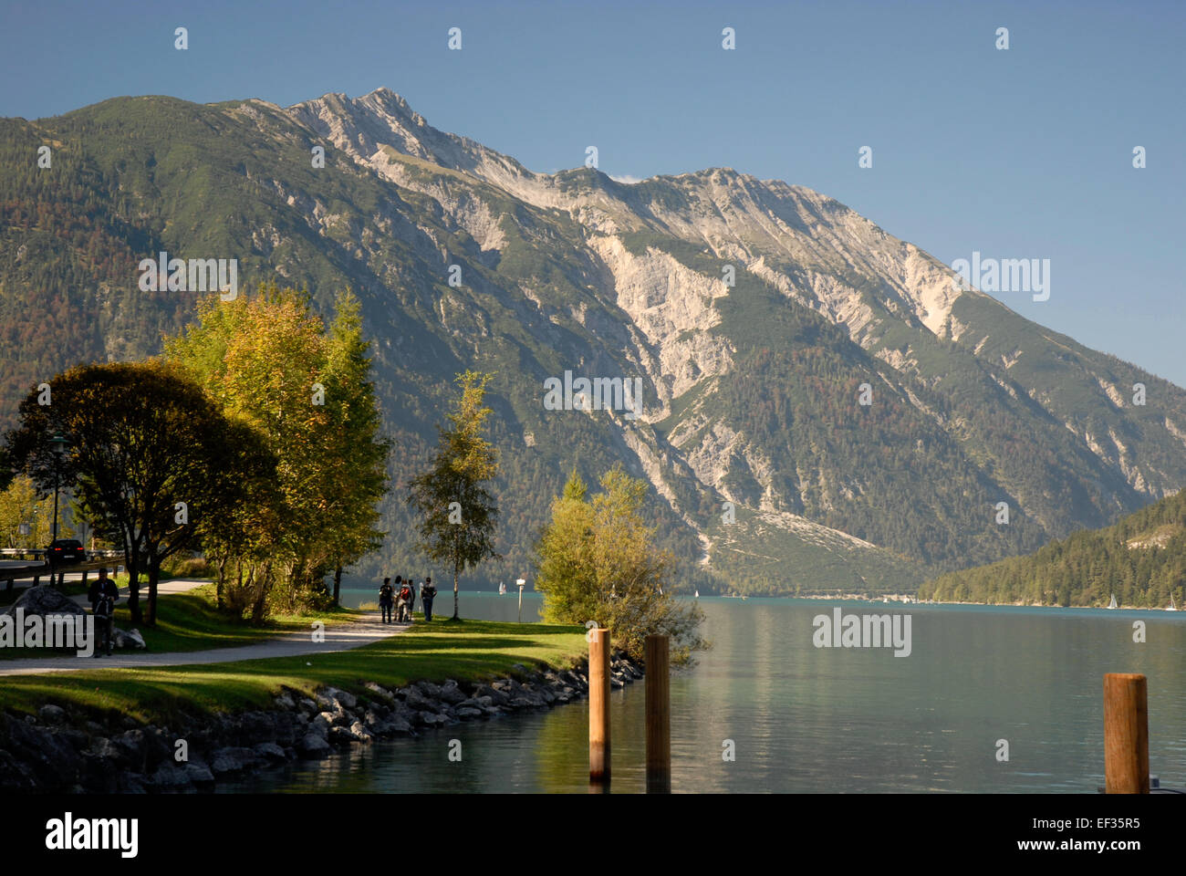 Achensee, a picturesque lake nestled in the Austrian Alps, is framed by ...