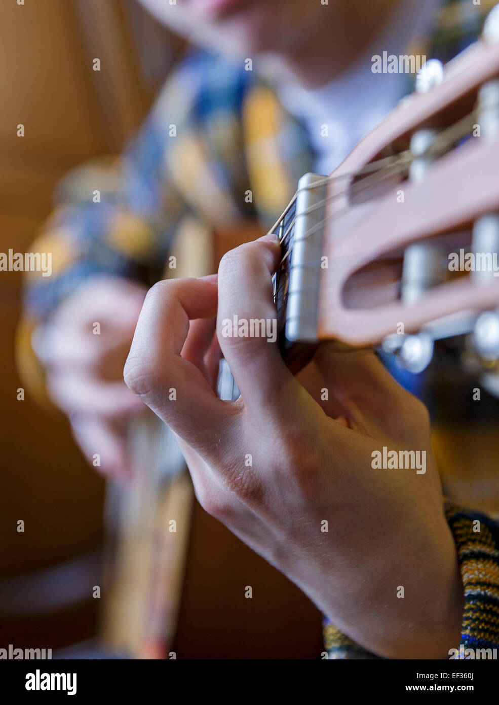 young guy playing classical guitar Stock Photo - Alamy