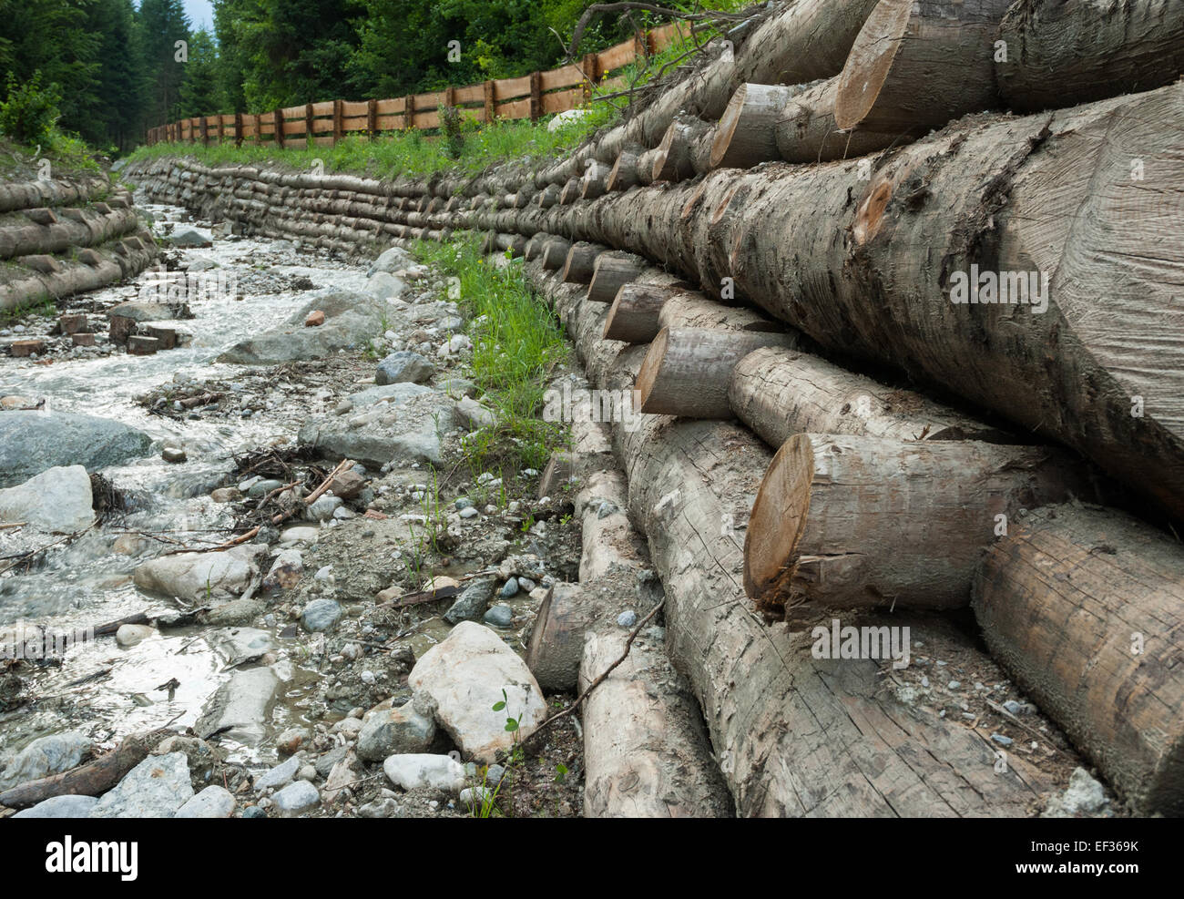 A wooden stream embankment in Baumkirchen, Austria, showcasing ...