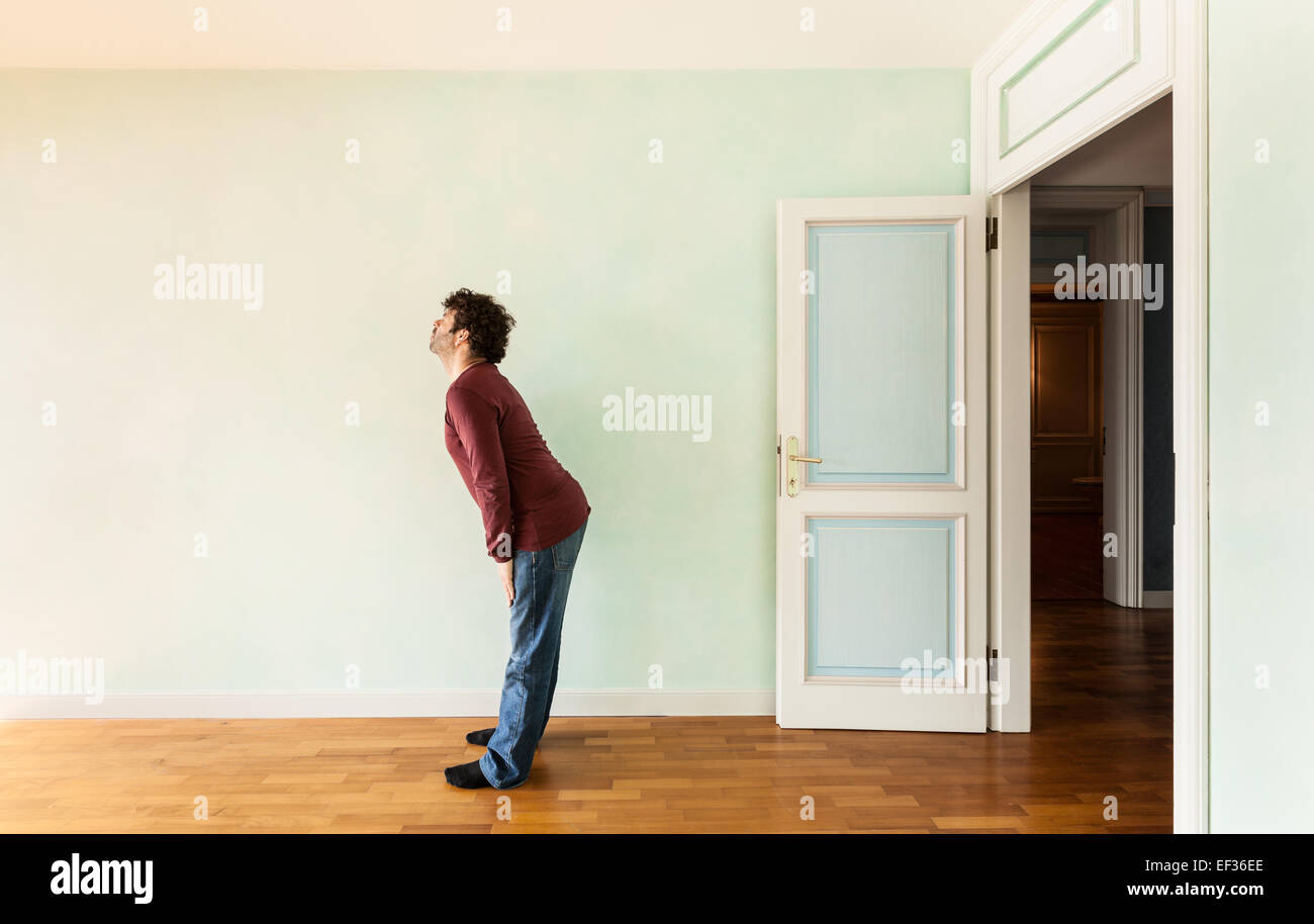 portrait of a weird guy in a room with the door open Stock Photo - Alamy