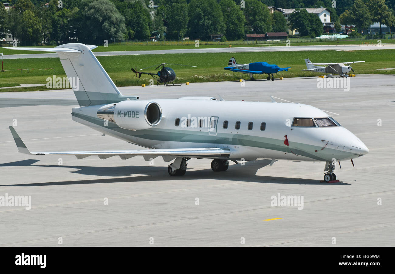 The Bombardier Challenger M-MDDE is a private jet seen in the skies ...