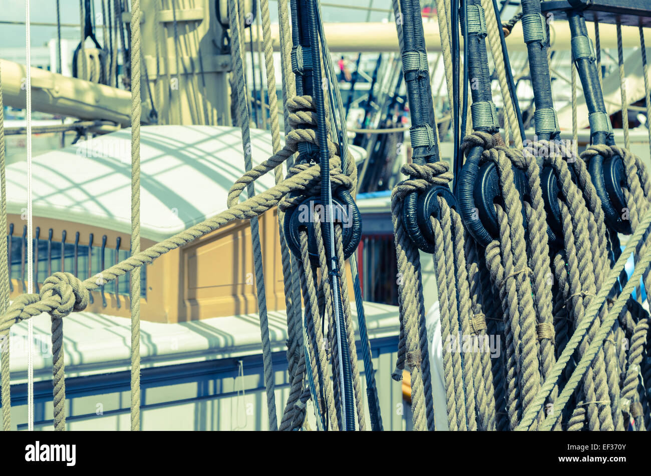Blocks and tackles of a sailing vessel. Cross process Stock Photo - Alamy