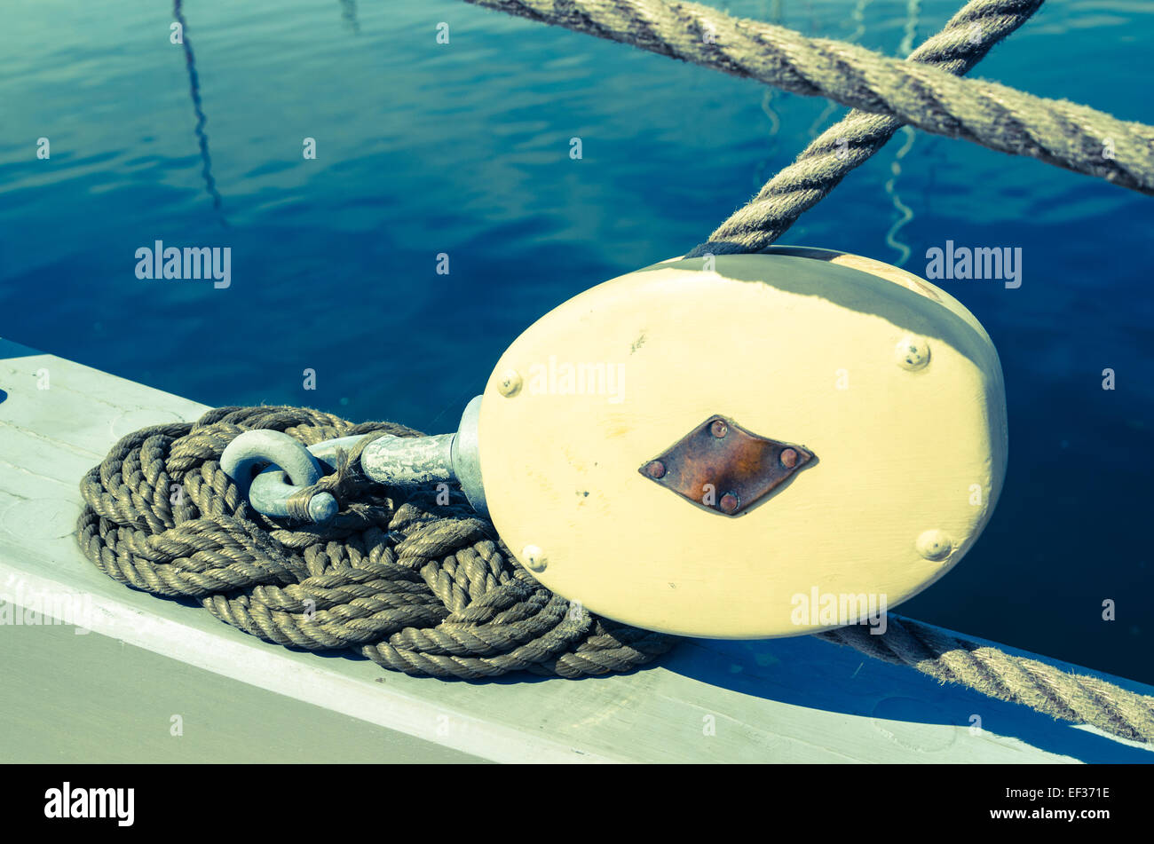 Blocks and tackles of a sailing vessel. Cross process Stock Photo - Alamy
