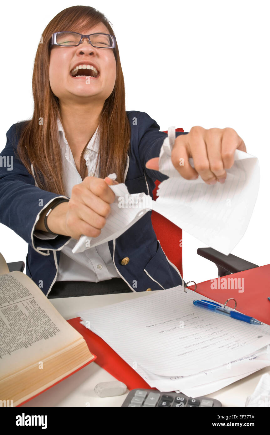 Frustrated teenage student tearing up her homework Stock Photo, Royalty ...