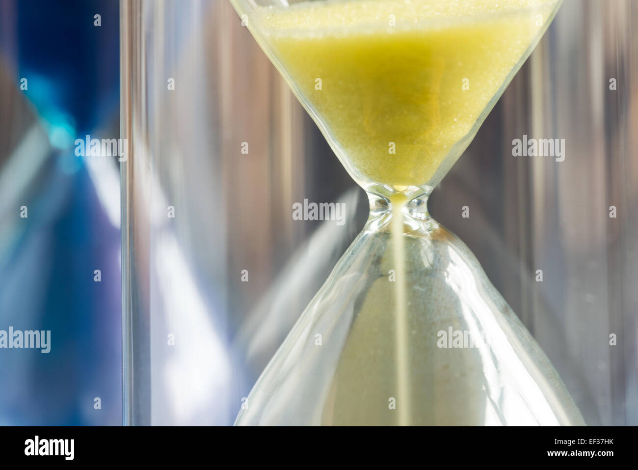 timer hourglass streaming grains of sand flowing through depicting ...