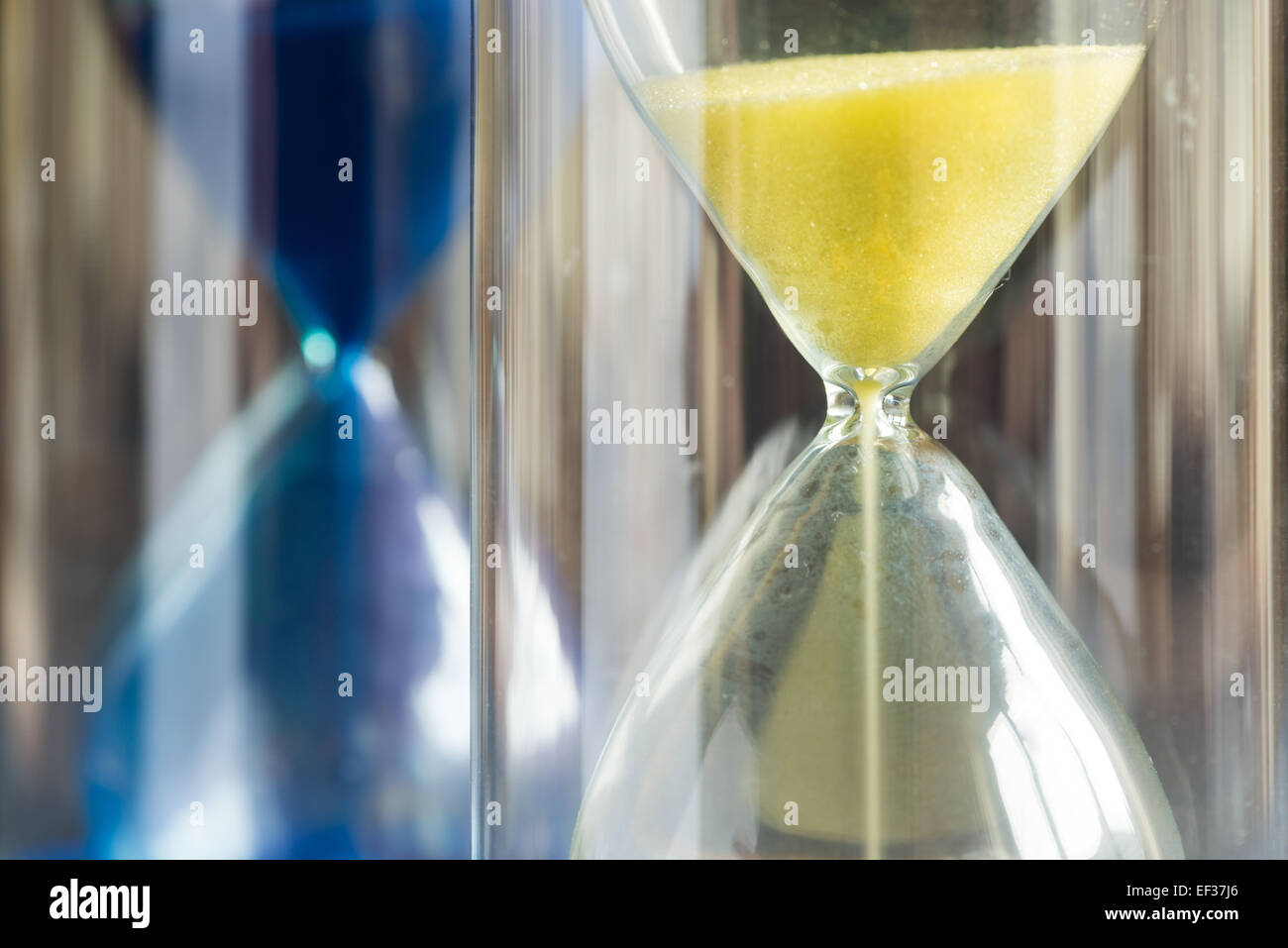 timer hourglass streaming grains of sand flowing through depicting ...