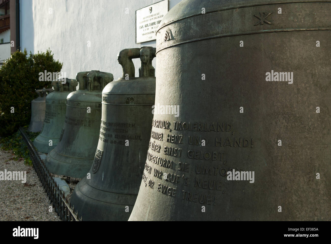 Bells in front of Vomper Church in Vomp, Austria, a historic site with ...