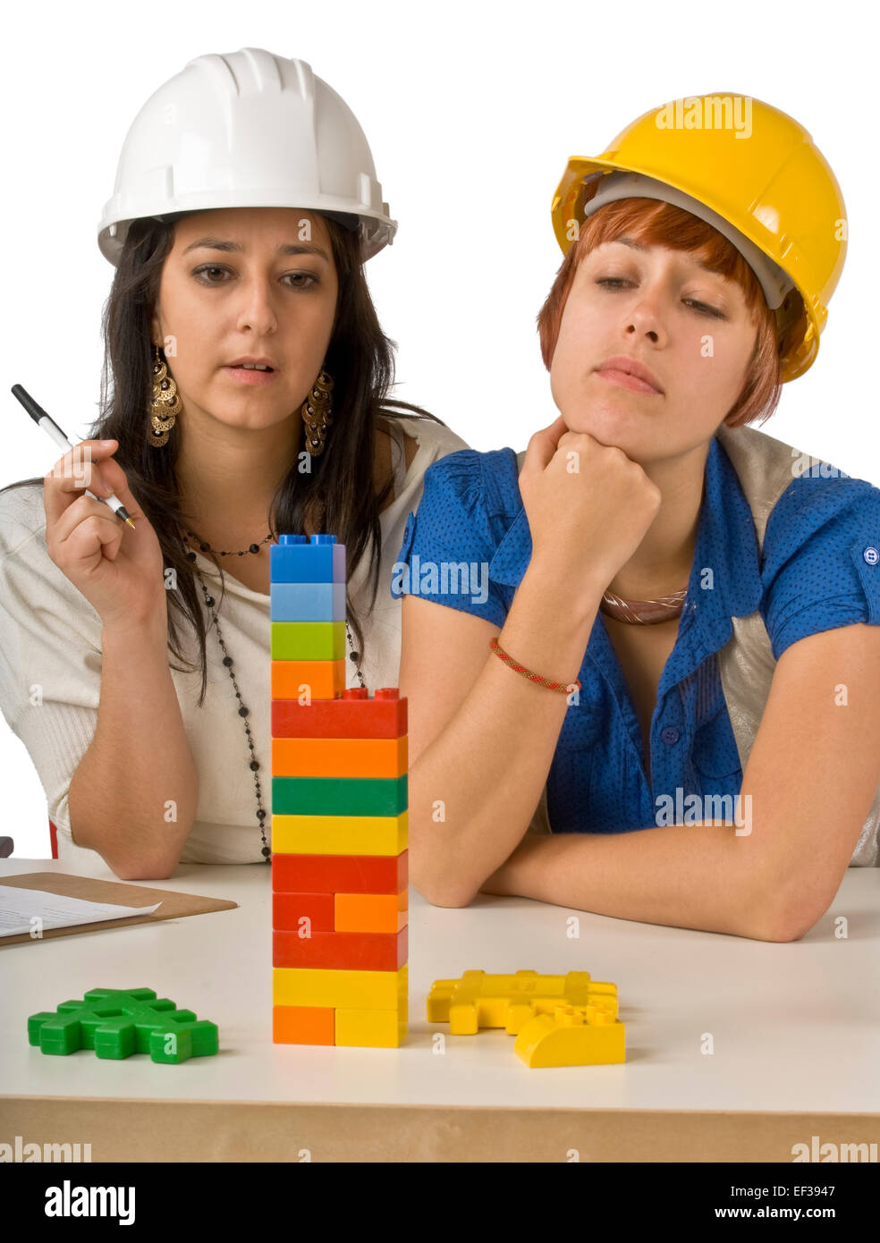 Two women looking at building blocks Stock Photo - Alamy Two women looking at building blocks Stock Photo - Alamy