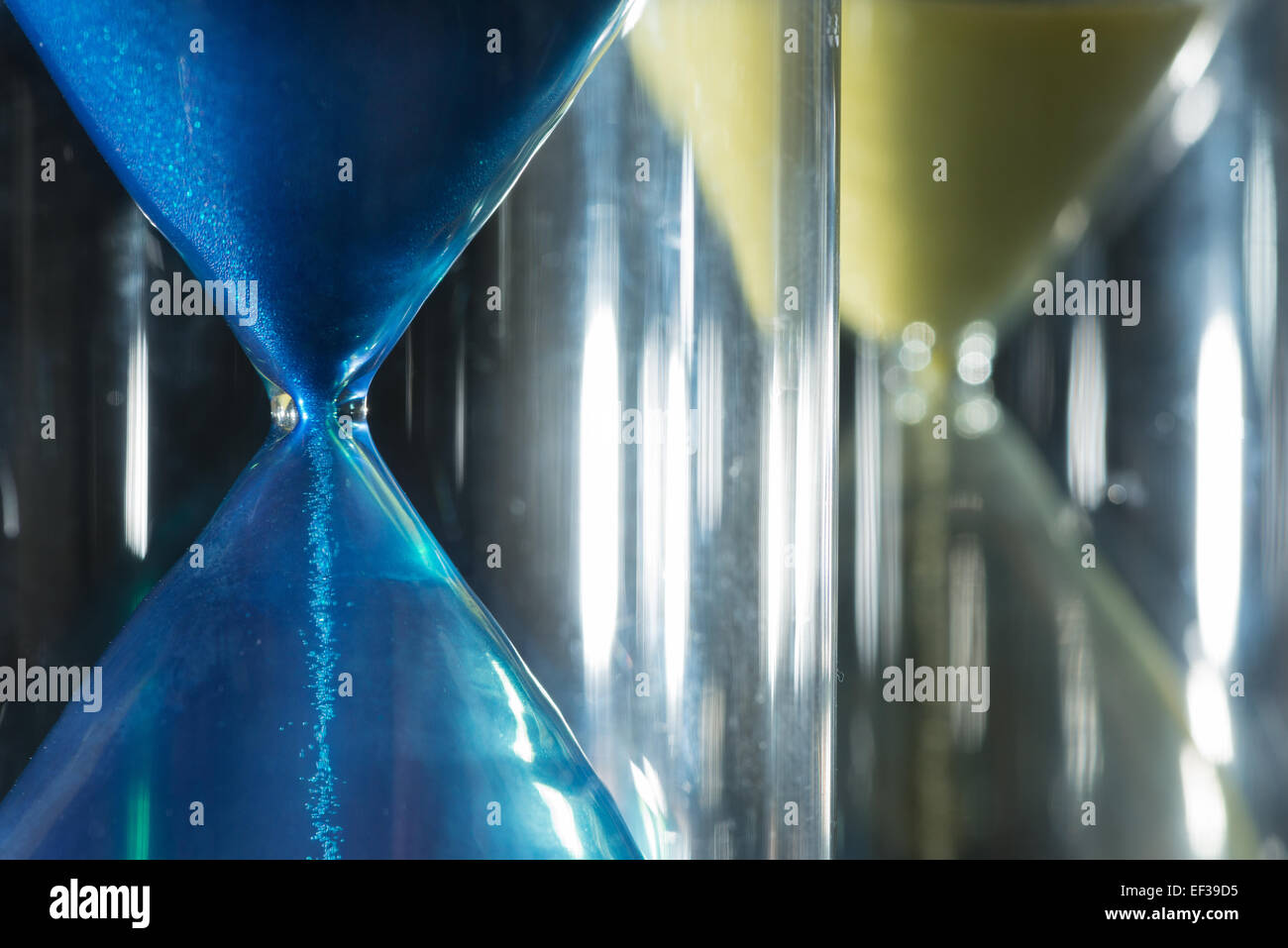 timer hourglass streaming grains of sand flowing through depicting ...