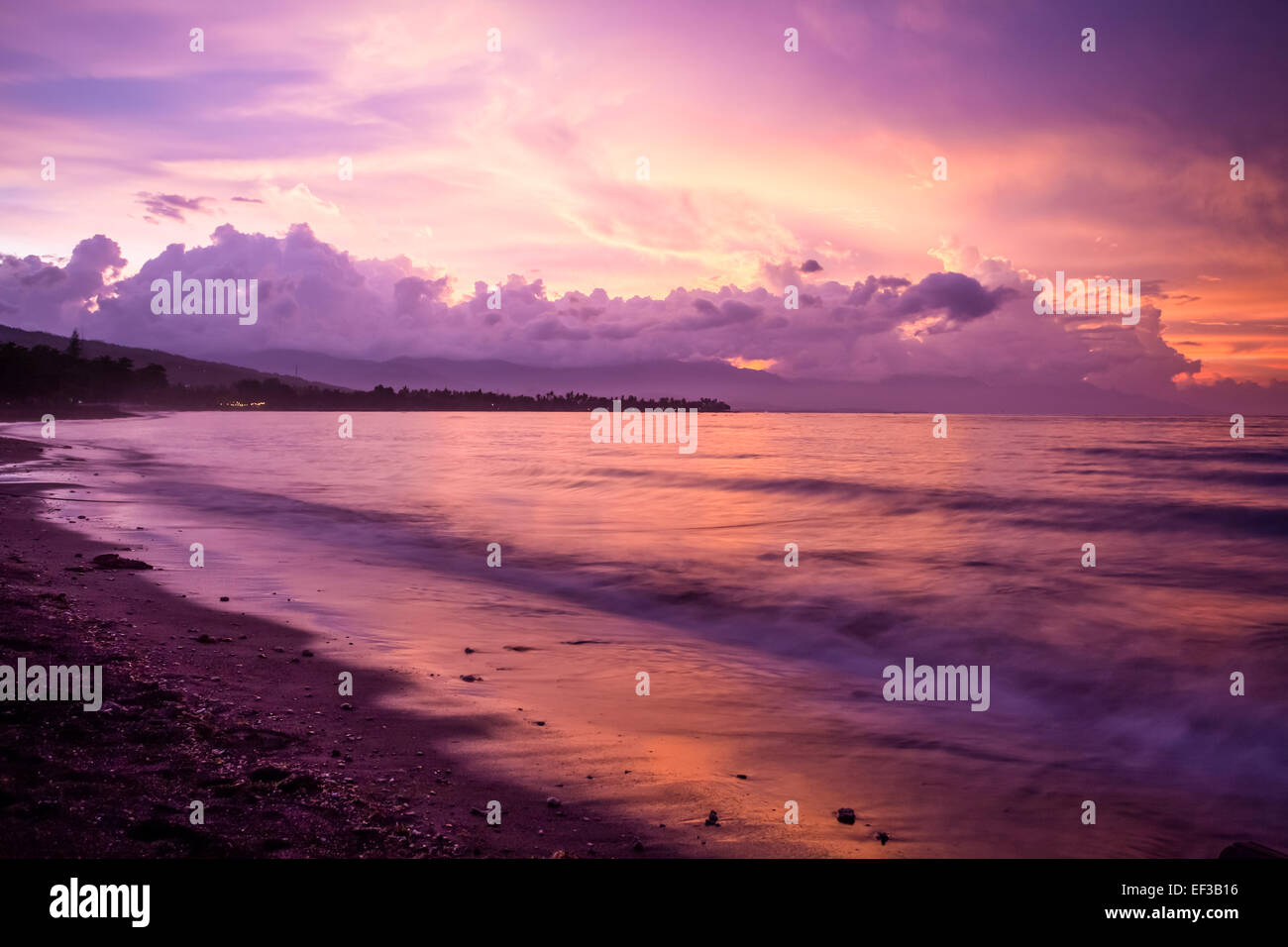 Vibrant tropical sunset at Bali indonesia Stock Photo - Alamy