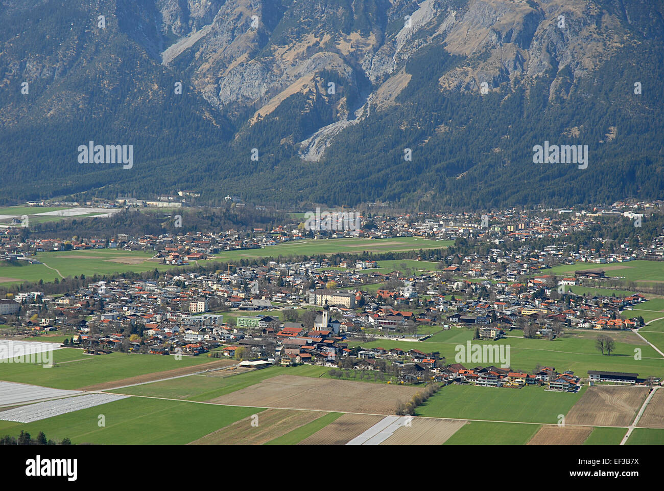 This photograph captures a scenic view of Mils, a town in Austria, from ...