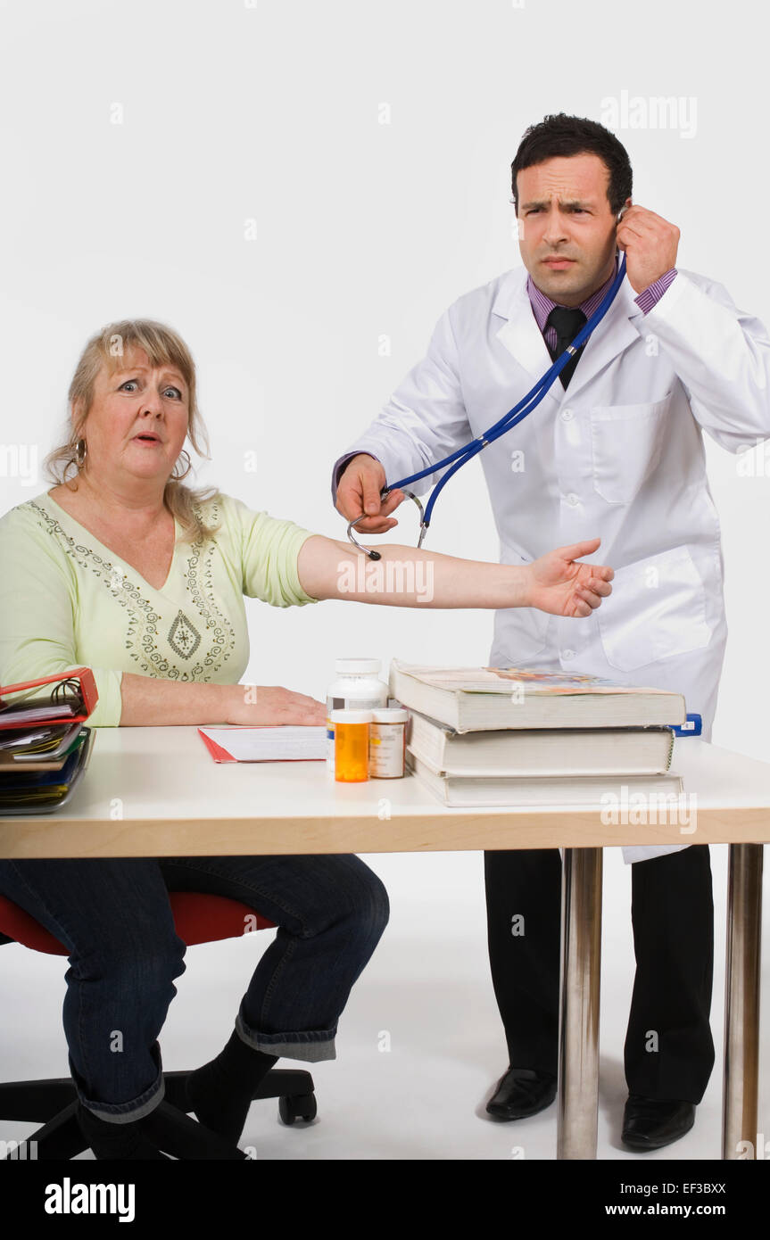 Doctor using stethoscope incorrectly Stock Photo - Alamy