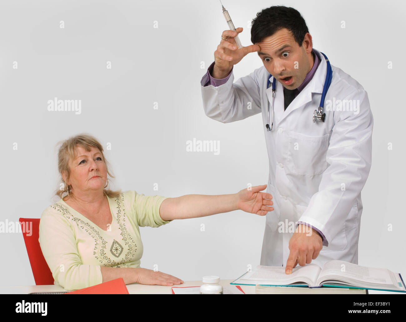 Doctor syringe pointing hi-res stock photography and images - Alamy