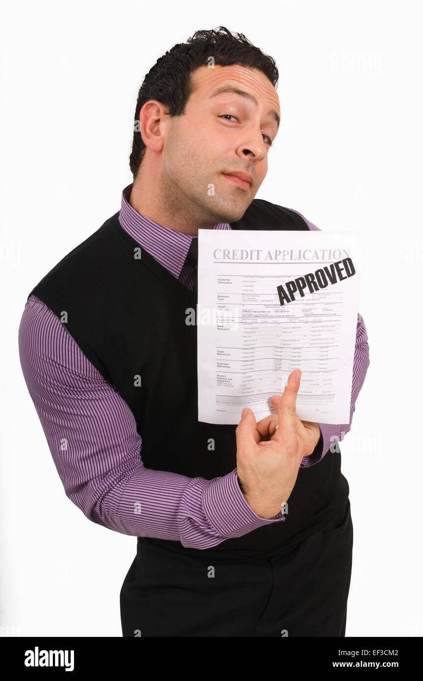 Man holding approved credit application Stock Photo - Alamy