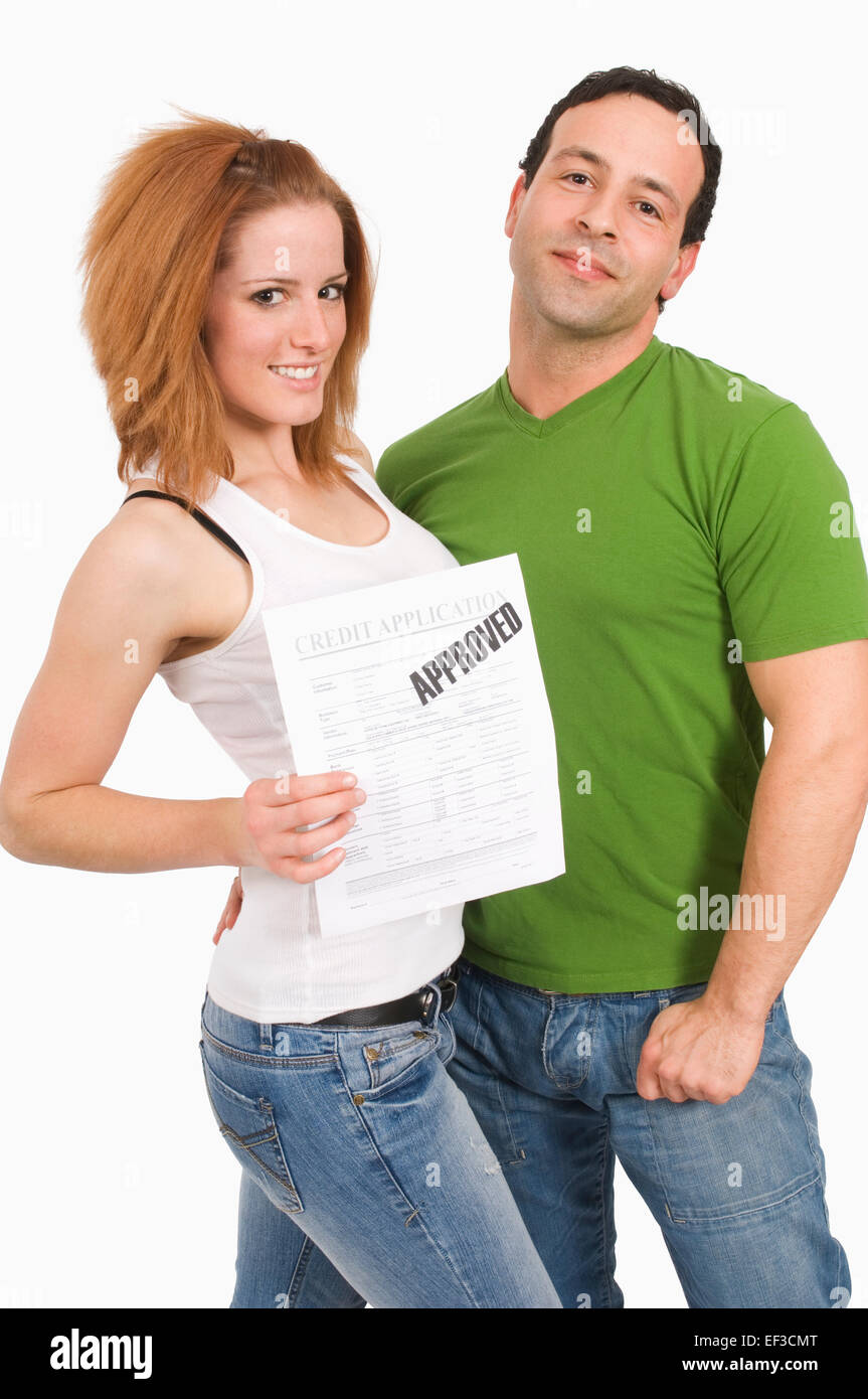 Couple celebrating approved credit application Stock Photo - Alamy