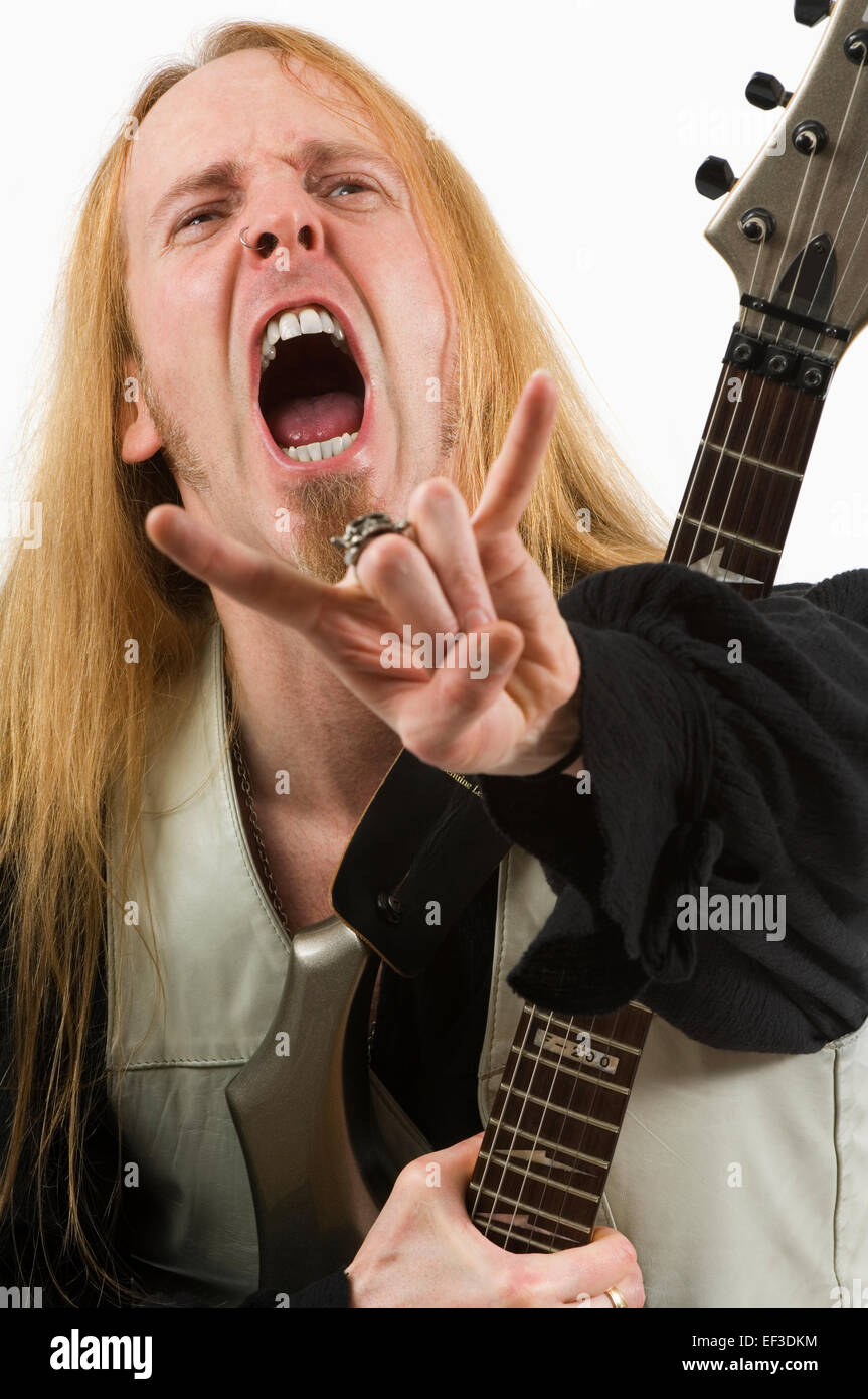 Guitarist giving peace sign Stock Photo - Alamy